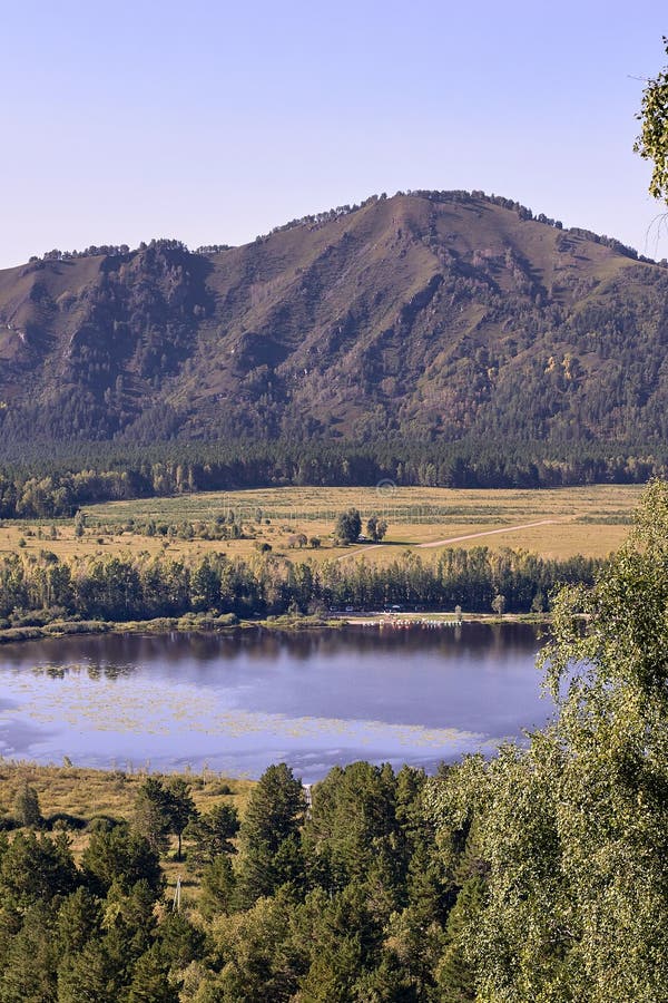 An Endless Expanse of Deep Blue Ocean Stretches To Meet the Soft, Cloud ...