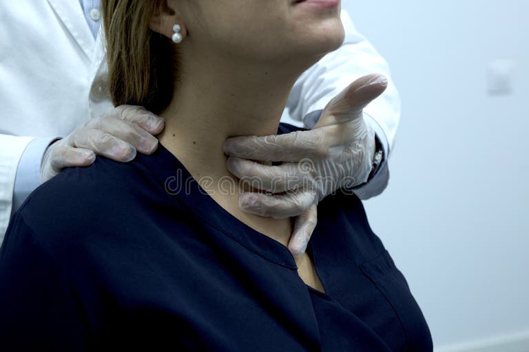 Endocrine Physician Performing a Physical Exam on the Neck of a Patient ...