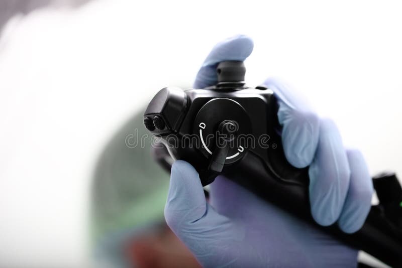 Endoscope in Doctor`s Hand during Medical Procedure. Stock Photo ...