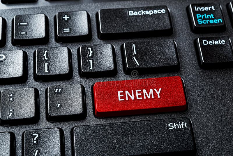 Enemy Word on the Red Enter Key of a Desktop Pc Keyboard. Laptop ...