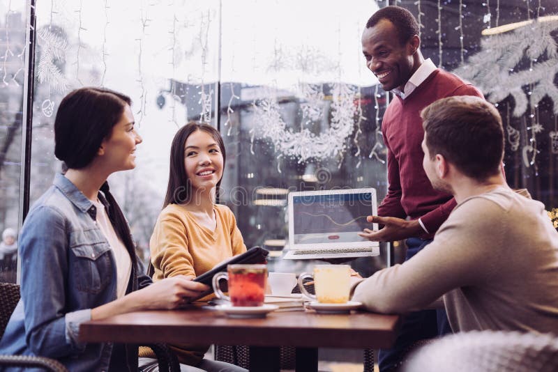 Energetic Four Colleagues Preparing Presentation Stock Photo - Image of ...