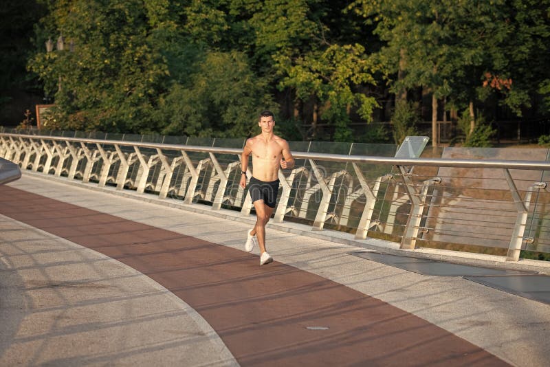 Energetic Man Runner with Muscular Torso Running Stock Photo - Image of ...