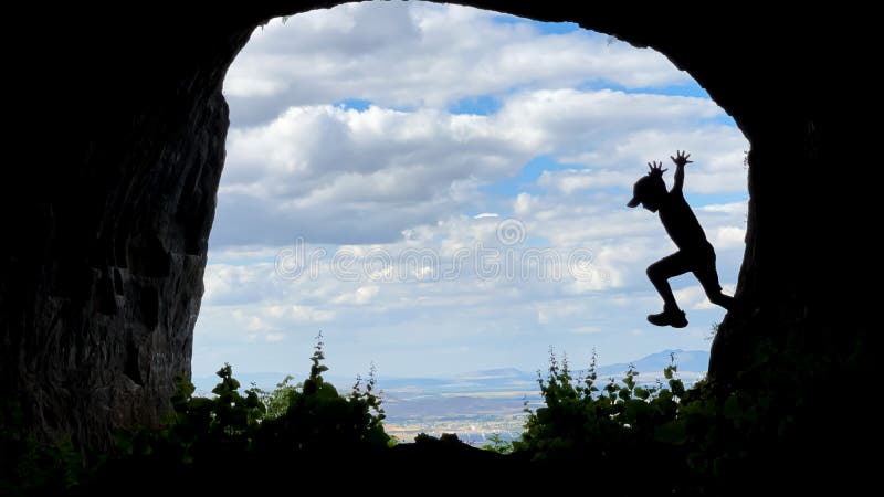 The Energetic Movements of an Adventurous Boy in the Cave Stock Image ...