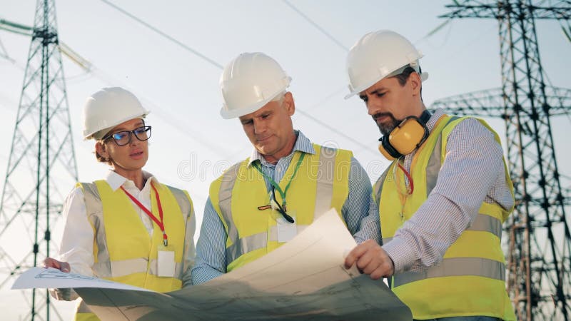 Energetics Workers are Talking while Observing Layouts Stock Video ...