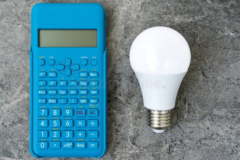 Energy Efficient Light Bulb and Blue Modern Calculator Stock Photo ...