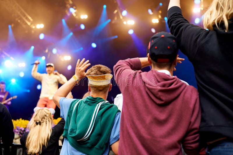 The Energy is Electric. Rearview Shot of a Crowd at a Concert with ...