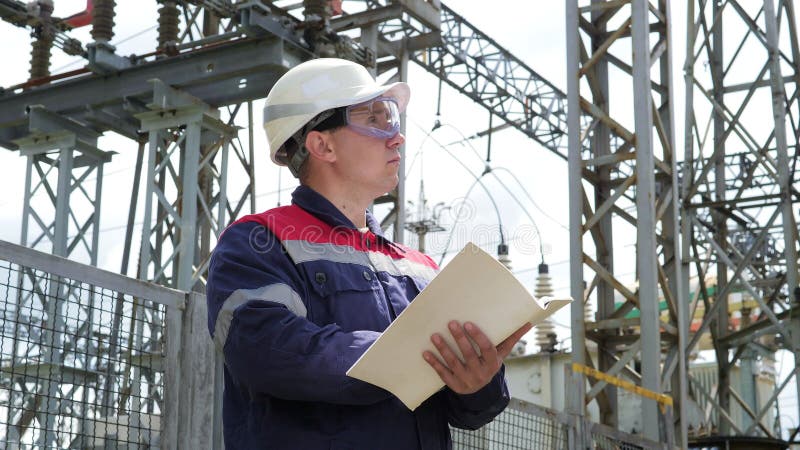 Two Engineer Working on Checking and Maintenance Equipment of the ...