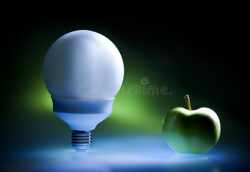 Energy Saving Bulb and Apple Stock Image - Image of bulb, nature: 26299197