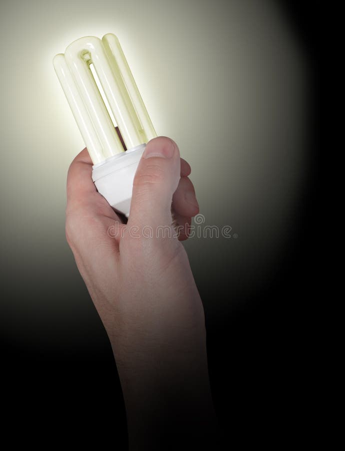 Energy Saving Bulb in Hand stock photo. Image of bright - 20109956