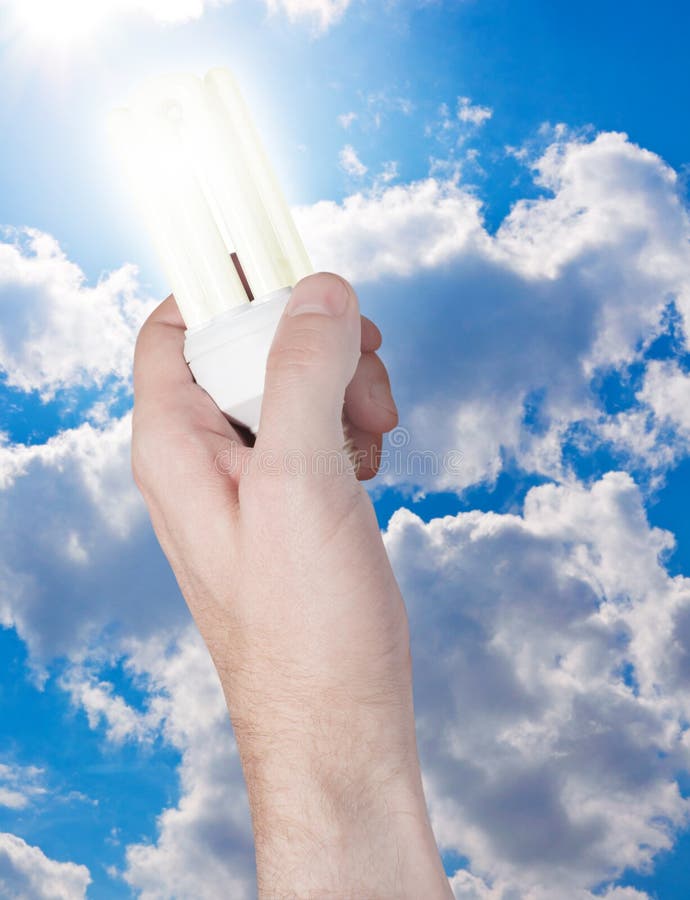 Energy Saving Bulb in Hand stock photo. Image of nature - 20110002