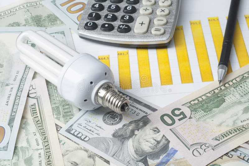 Energy Saving Lamp Chart And Calculator On Money Background Energy