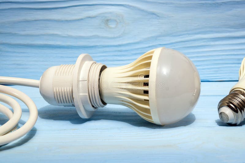 Energy Saving Light Bulb and Cable for Installation Against the ...