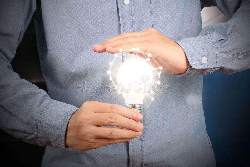 Energy Saving Light Bulb in Hand Stock Photo - Image of isolated ...