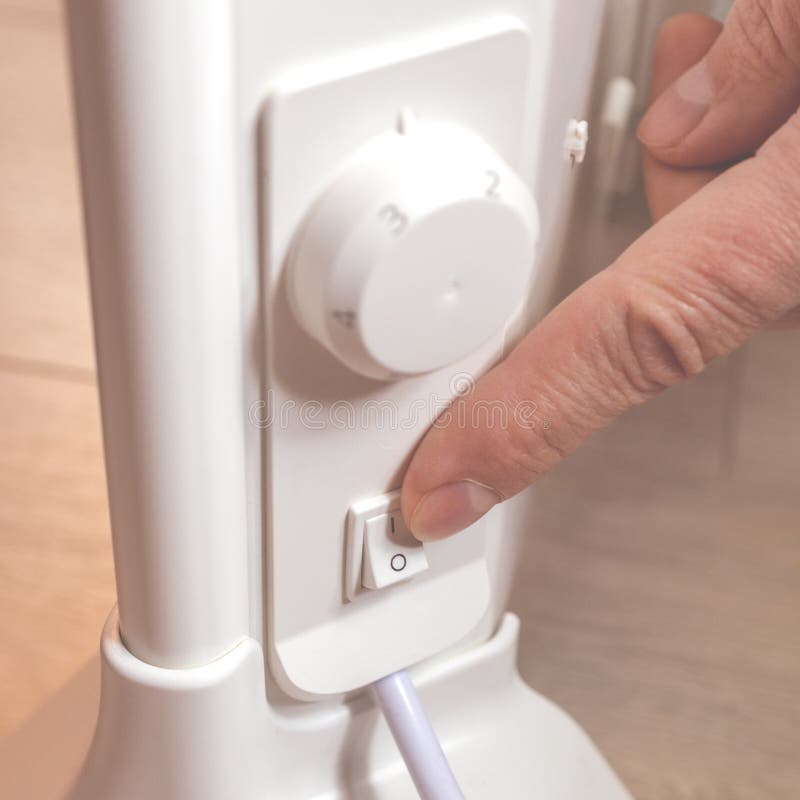 Energy Saving. Switch Off Button of the Electrical Appliance. Finger on ...