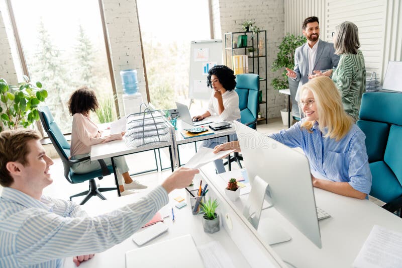 Engaged Coworkers Collaborating in a Lively and Productive Office ...