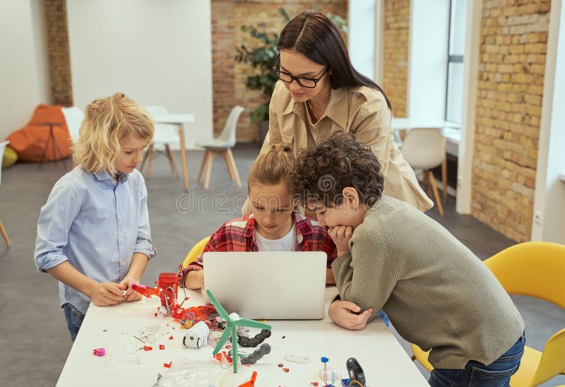 Concentrated Kids Drawing a Bright Poster in a Class Stock Photo ...