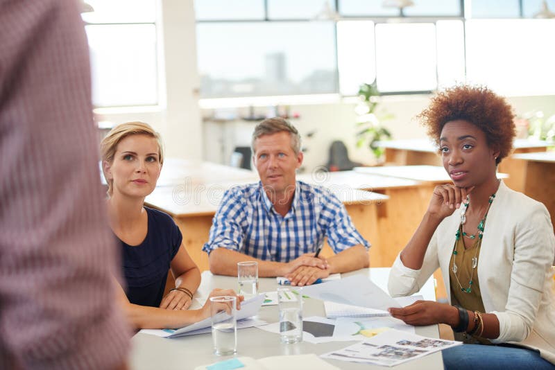 Engaged in a Thought Provoking Presentation. a Team of Young ...