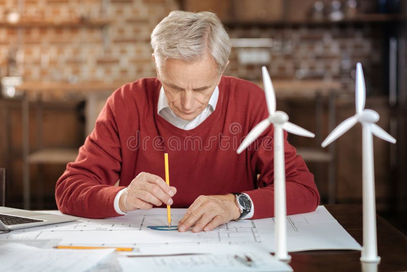 Grey-haired Man Using Protractor while Drawing Blueprint Stock Image ...