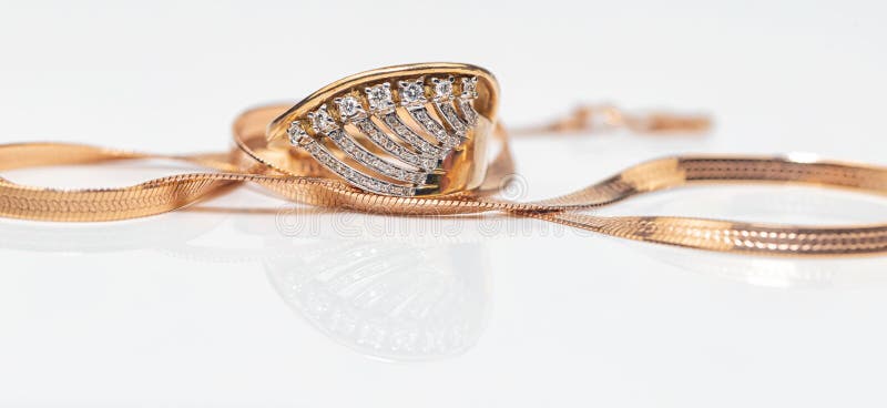 Engagement Ring of Gold and Different Weave Chain Stock Photo - Image ...