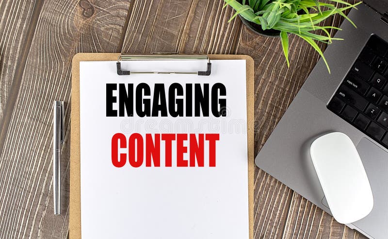 ENGAGING CONTENT Text on Clipboard Paper with Laptop, Mouse and Pen ...