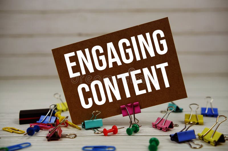 Engaging Content Text on Paper Card with Stationary on Wooden ...