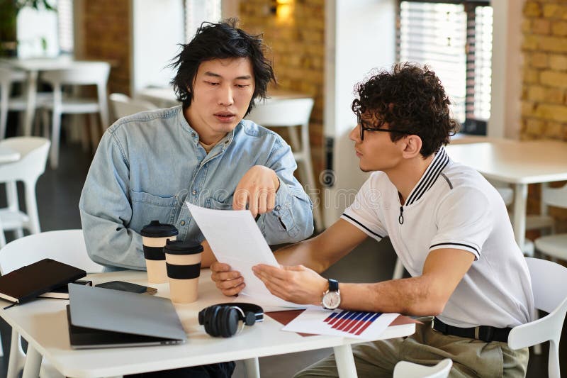 Engaging Discussion between Colleagues in a Stock Image - Image of ...