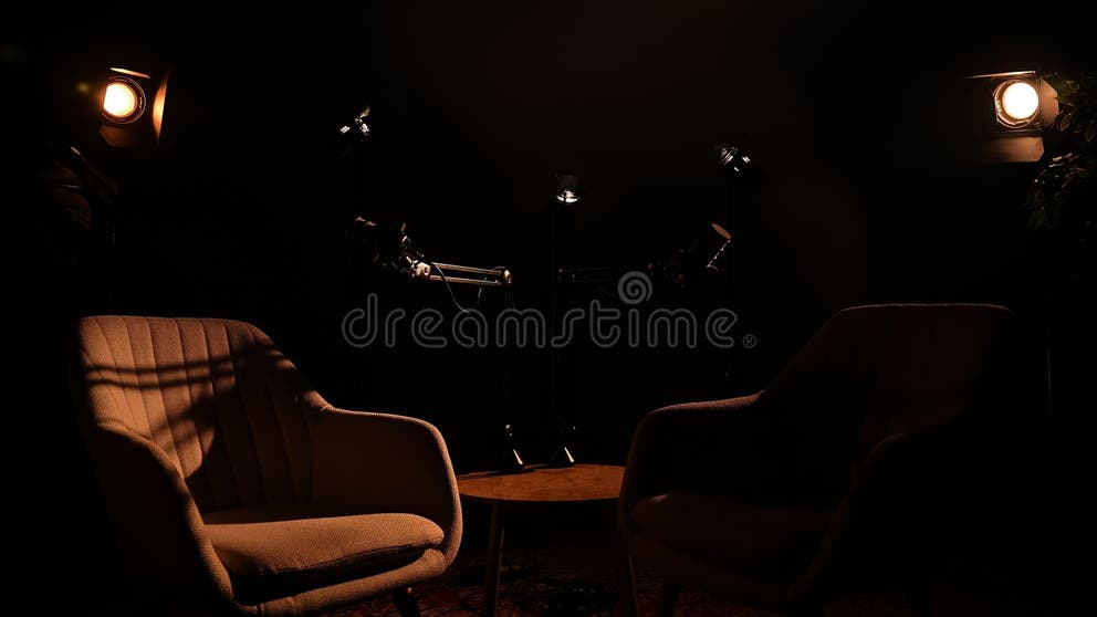 Engaging Discussions Unfold in a Dimly Lit Podcast Studio with Inviting ...