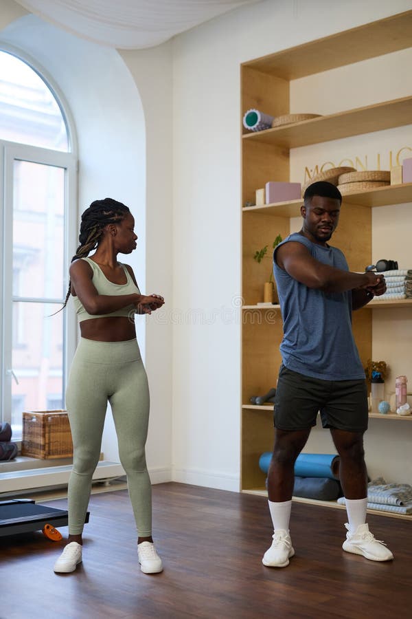 Engaging in Indoor Exercise Routine Together Stock Photo - Image of ...