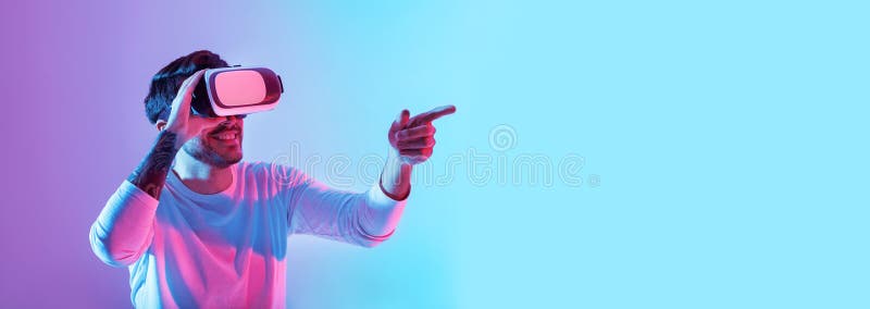 Engaging Man Experiences Virtual Reality at Modern Tech Space Stock ...