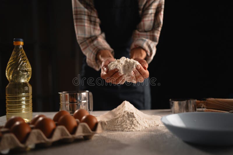 Engaging in the Process of Adding Flour To the Mixture As Part of the ...