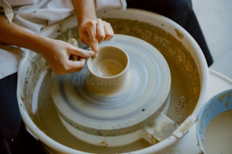 Engaging in the Process of Crafting Exquisite Ceramic Pottery Using a ...