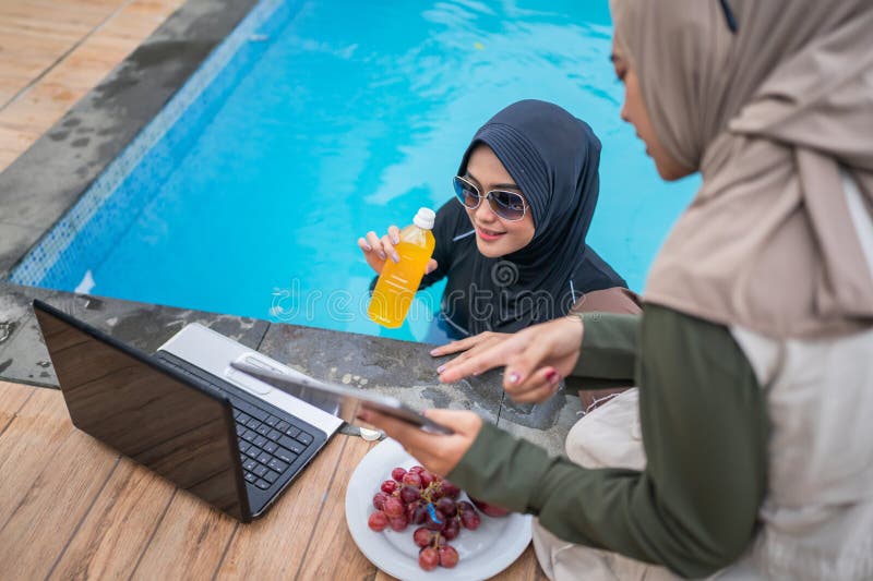 Engaging in Social Activities by the Pool Friends Savoring Refreshments ...