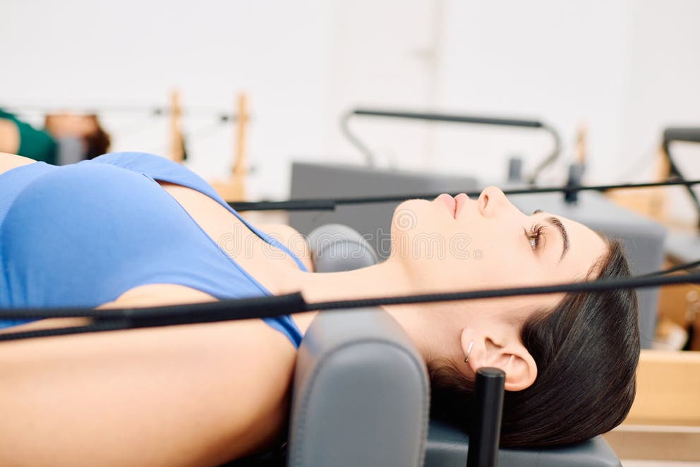 Engaging in Strengthening Exercises in a Stock Photo - Image of body, reformers: 367390970