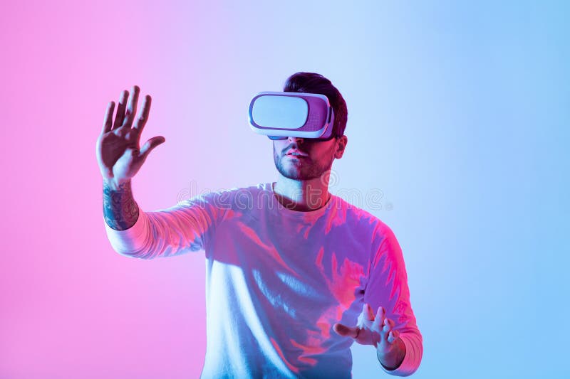 Engaging with Virtual Reality in a Neon-lit Environment Stock Image ...