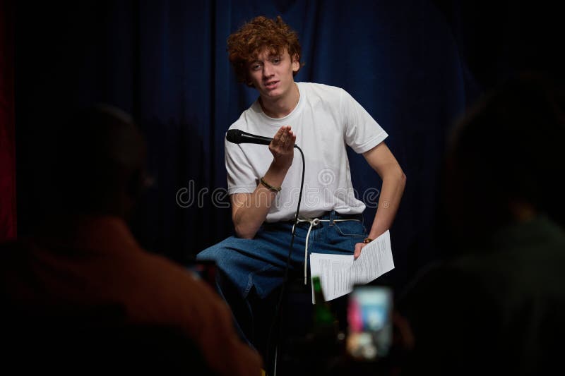 Engaging Young Man Speaking during Live Performance Stock Image - Image ...