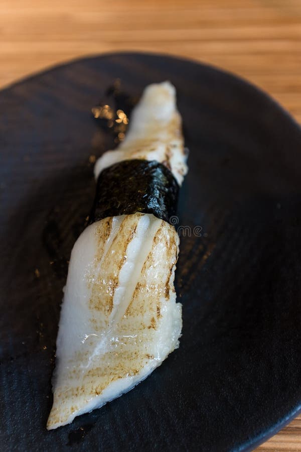 Engawa Sushi stock image. Image of sushi, piece, black - 49980641