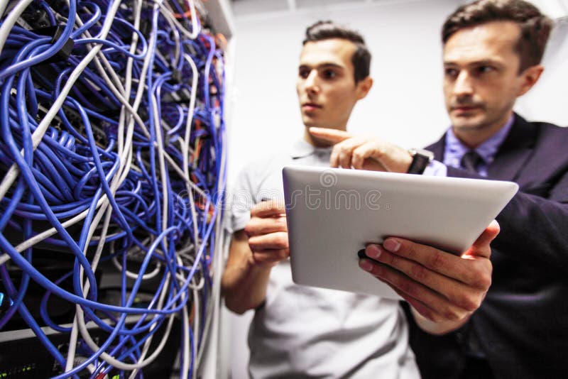 Engeneers in Network Server Room Stock Image - Image of showing, center ...