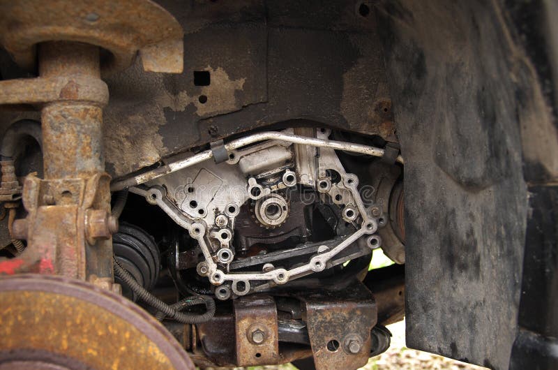 Engine, Absorber and Rusty Brake Disc on a Broken Car in the Yard Stock ...