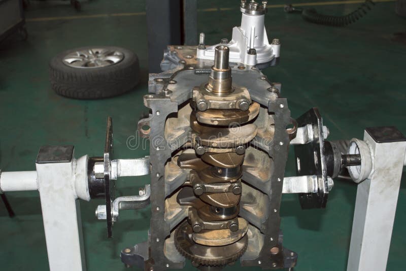 The Engine Block with a Crankshaft and a New Pump is Installed on the ...
