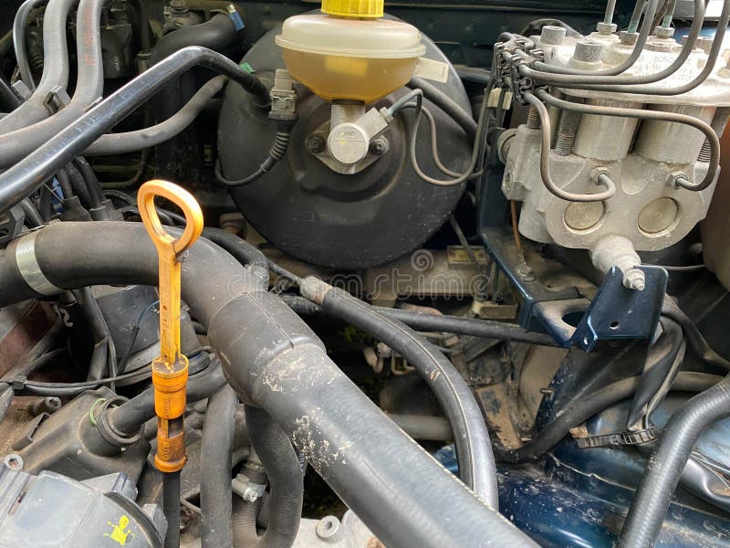 Engine Compartment Under Car Hood with Emphasis on Oil Dipstick ...