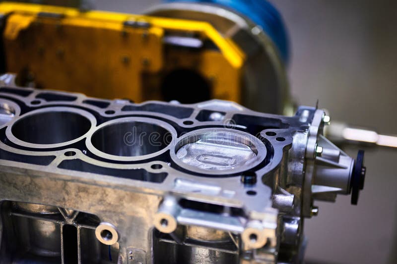 Engine Cylinder Block with Installed Pistons in Workshop Stock Photo ...