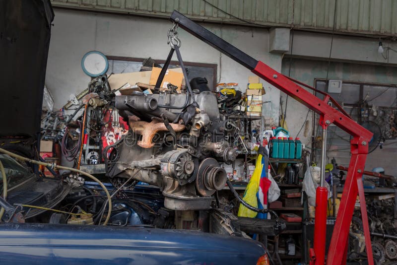Engine Hanging on Crane Hook on Car Repair Service. Photo of Old Engine ...