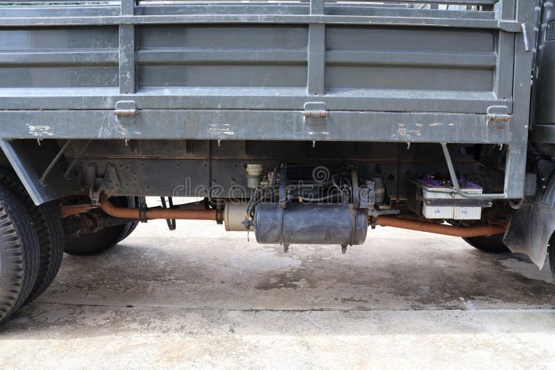 The Engine of a Heavy Truck Undercarriage Seen Under the Car and Wheels ...