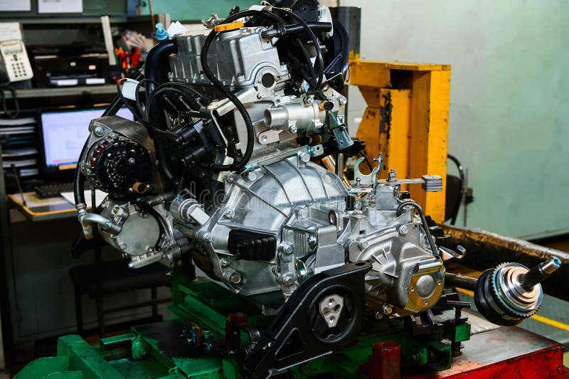 Engine Installing in Car Compartment in Assembling Workshop Stock Photo ...