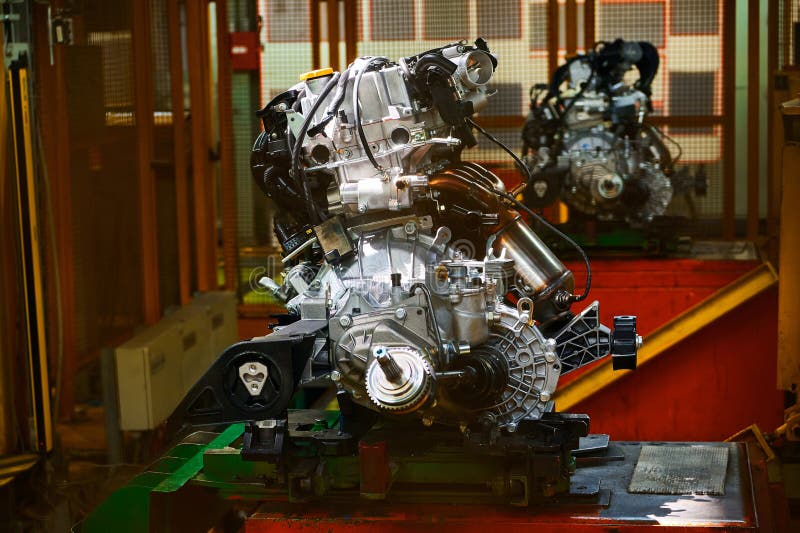 Engine Installing in Car Compartment in Assembling Workshop Stock Photo ...