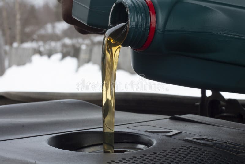 Engine Oil Change. Refueling with Fresh Engine Oil Stock Photo - Image ...