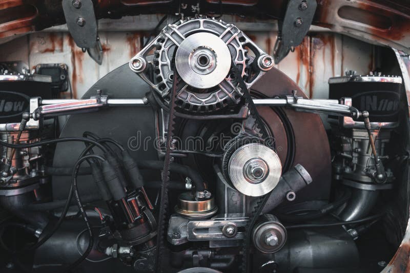 Engine of an Old Car, with Polished Metal Details, Belts and Mechanical ...