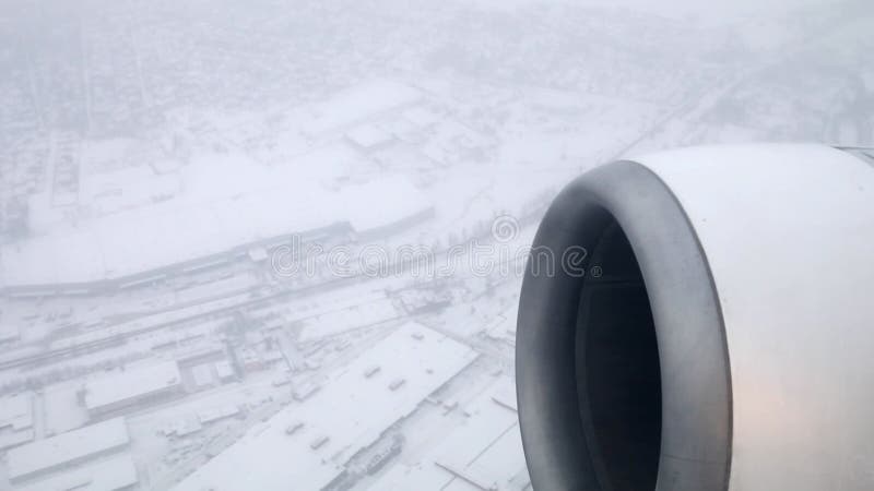 Engine of the Plane and Snow-covered City from the Stock Video - Video ...