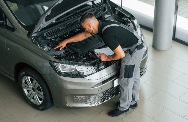Engine repair stock photo. Image of autosalon, employee - 254915636