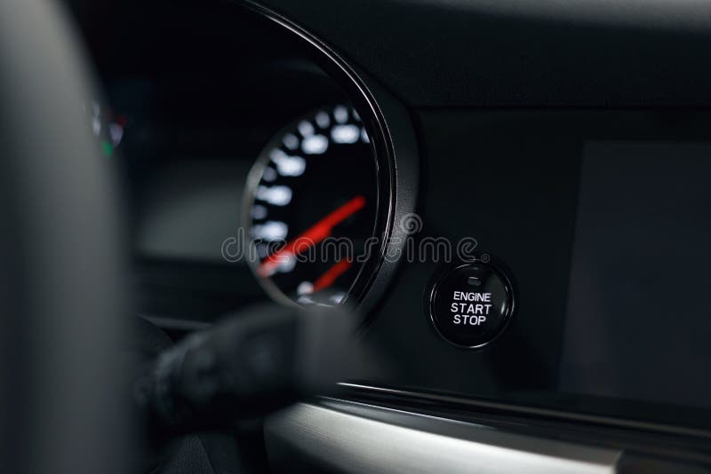 Car Start-Stop Engine Button of a Modern Car in the Interior Stock ...